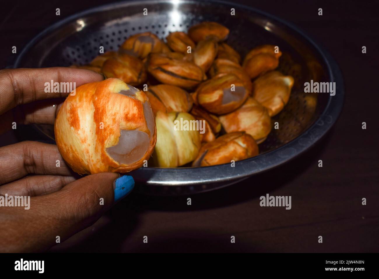 Female holding Ice apples also known as Palmyra from a Palm tree. Toddy ...