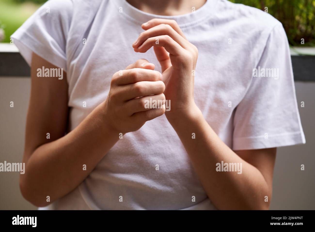 Hands of a little boy practicing EFT or emotional freedom technique ...