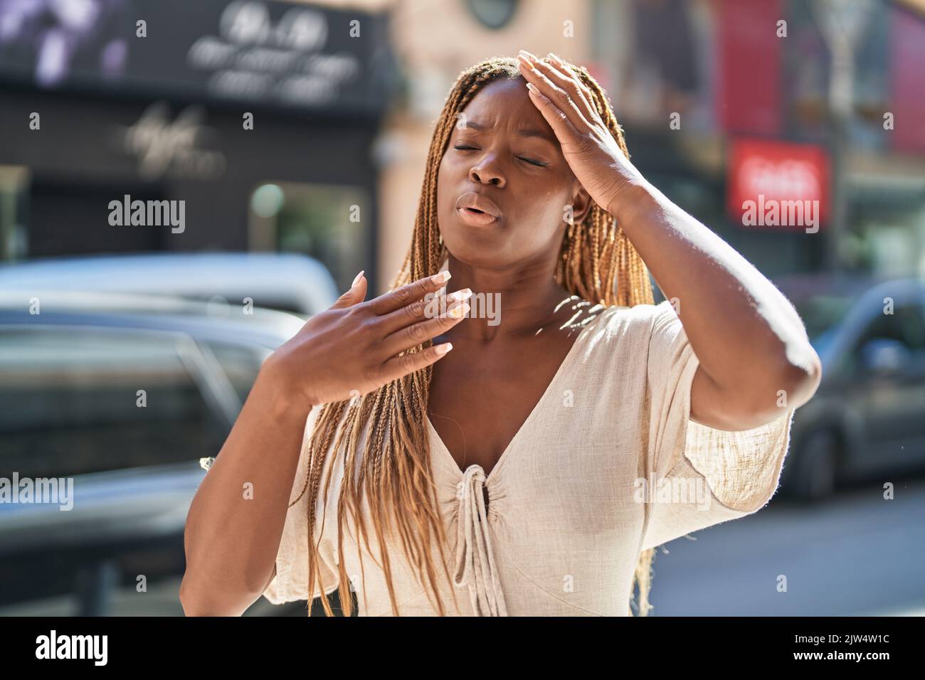 African american woman sweating at street Stock Photo - Alamy