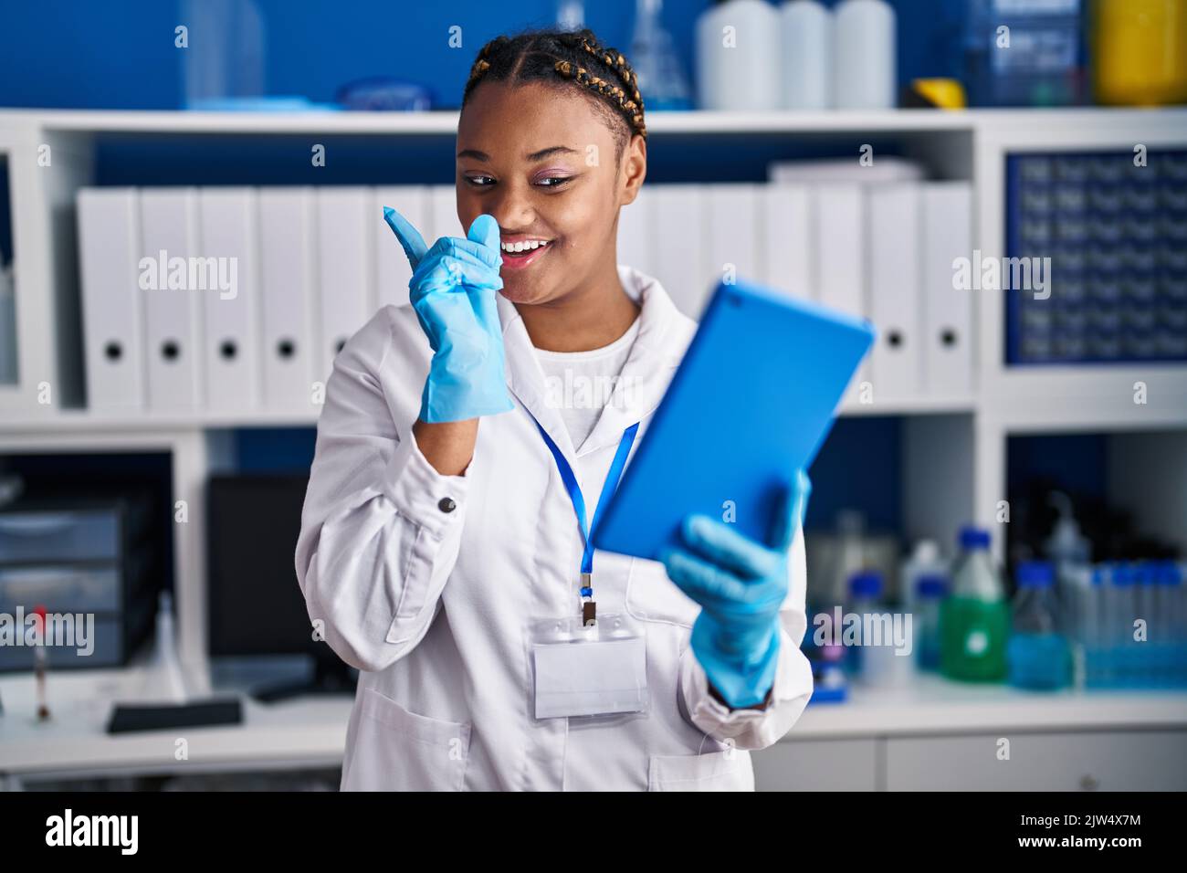 African american woman with braids working at scientist laboratory ...