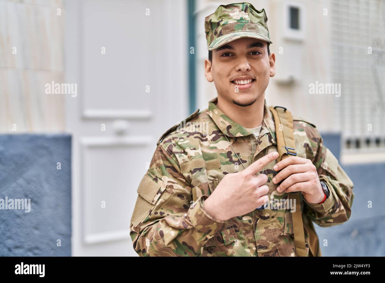 Young arab man wearing camouflage army uniform outdoors smiling happy ...