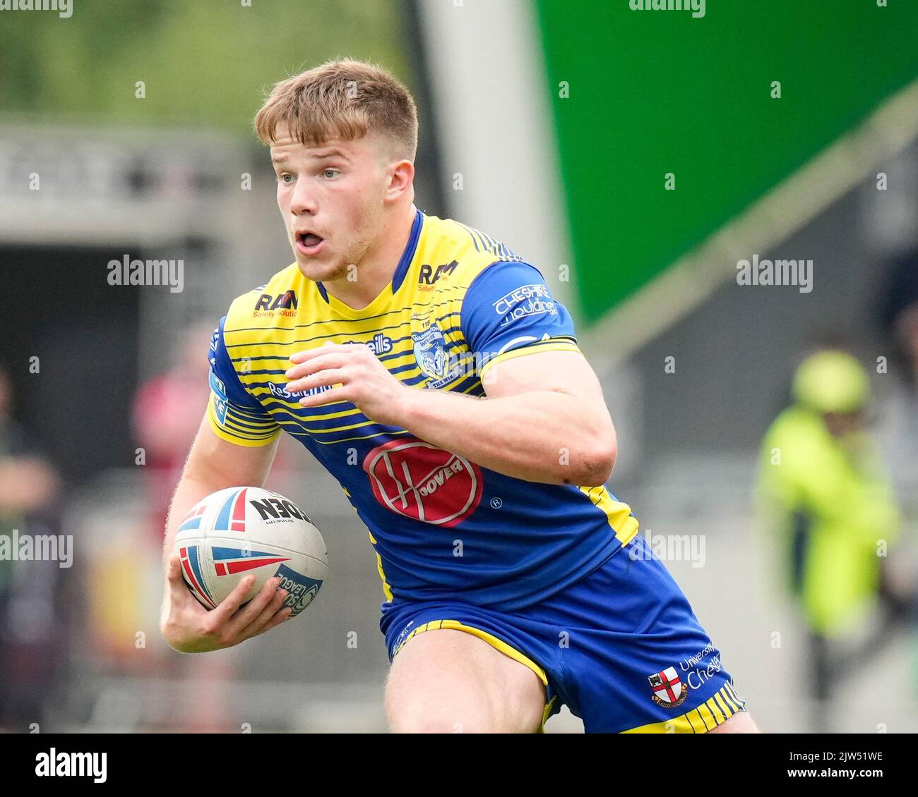 Luke Thomas #38 of Warrington Wolves runs with the ball during the ...