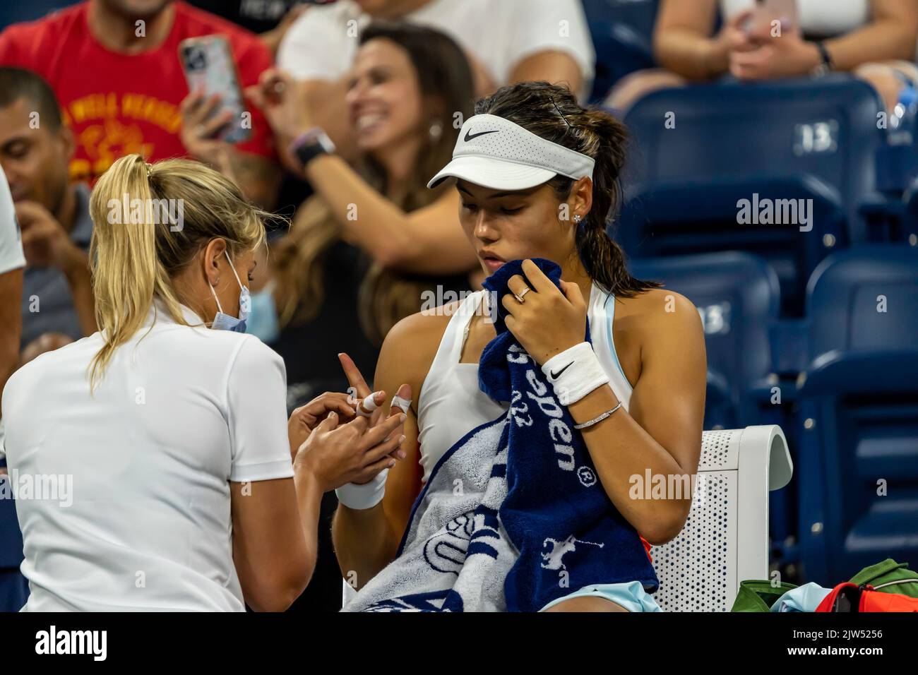 Emma Raducanu (GBR) having blisters on her hand attended to during her ...