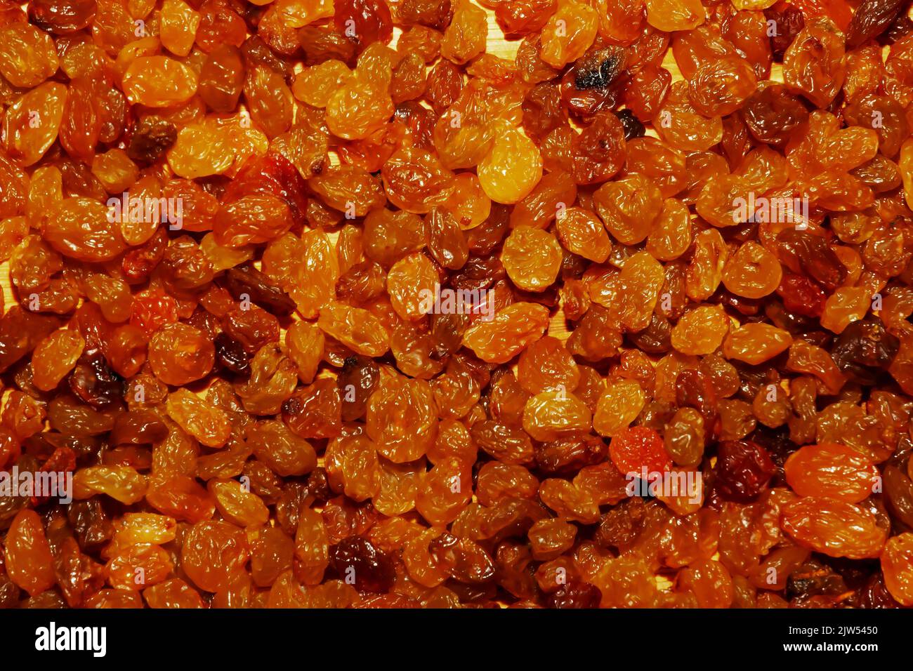 Texture of yellow raisins from white grapes. Raisins background Stock ...