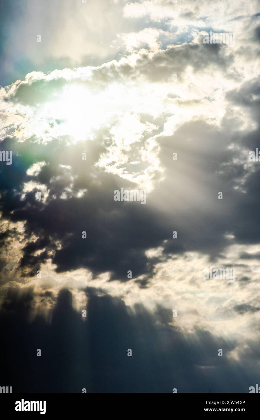 Dramatic sky with clouds and sun rays in sunsetting time Stock Photo ...