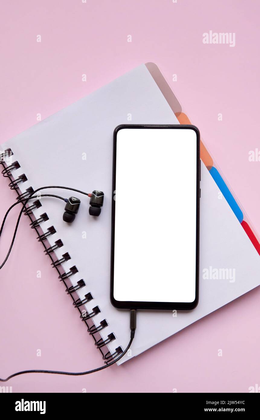 Mobile phone mock up template screen with earphones and notebook, flat ...