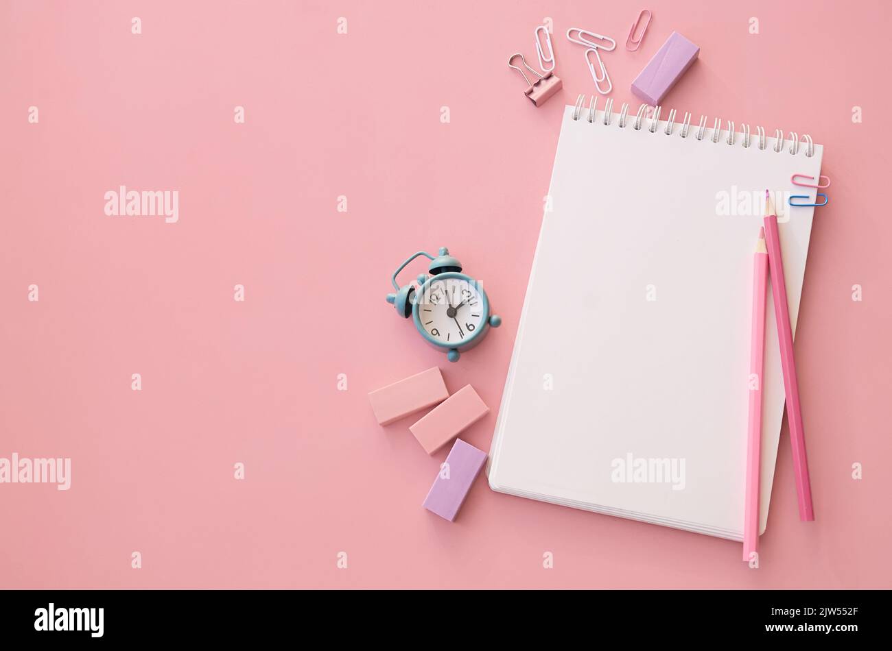 School stationery supplies accessories on pink background, flat lay ...