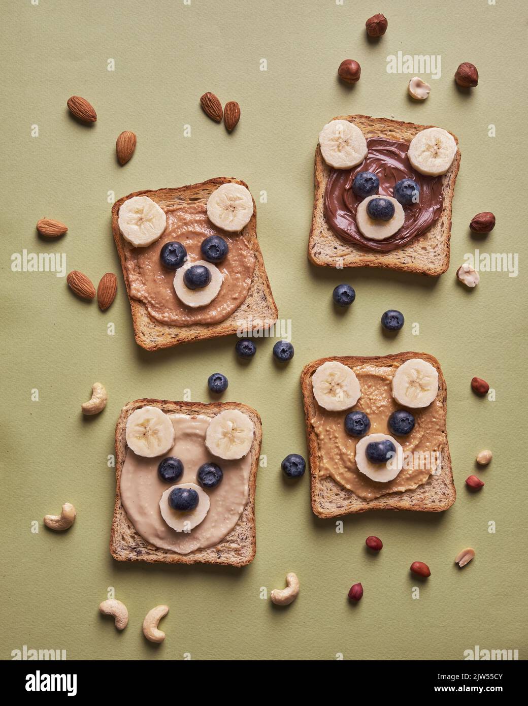 Funny children bear toasts with nuts butters Stock Photo - Alamy