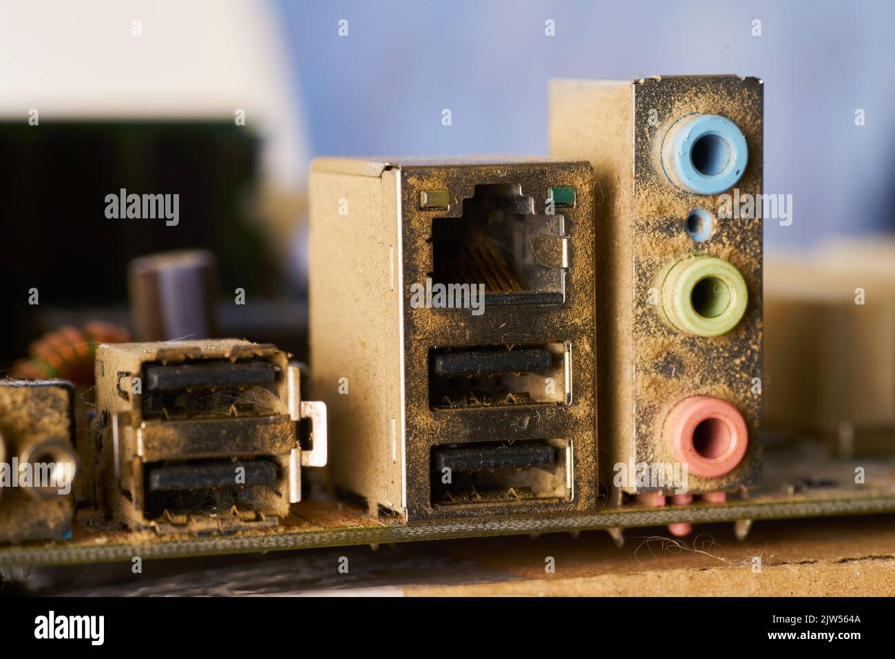 A thick layer of dust covers the internal electronic components of the ...