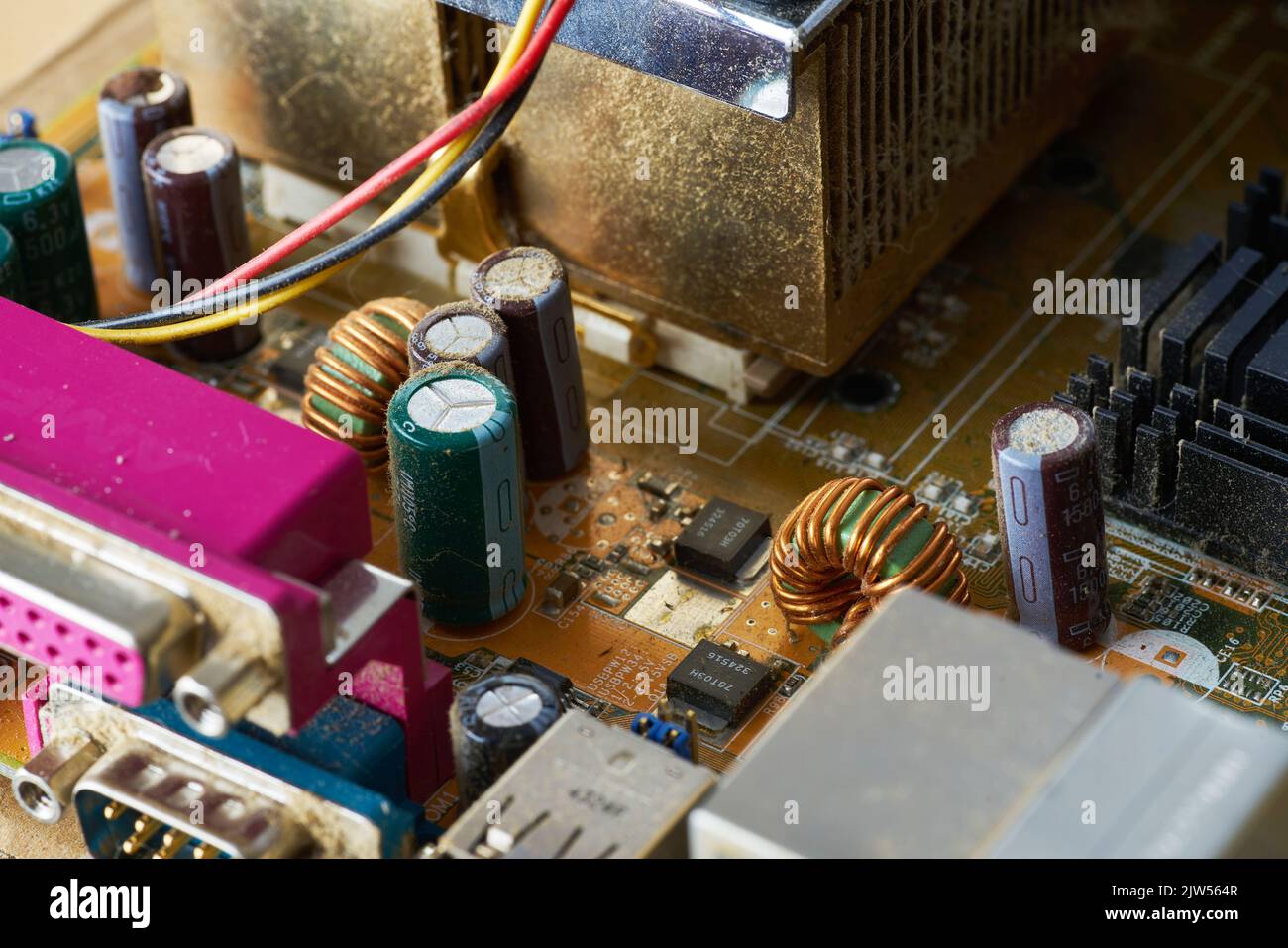 A thick layer of dust covers the internal electronic components of the ...