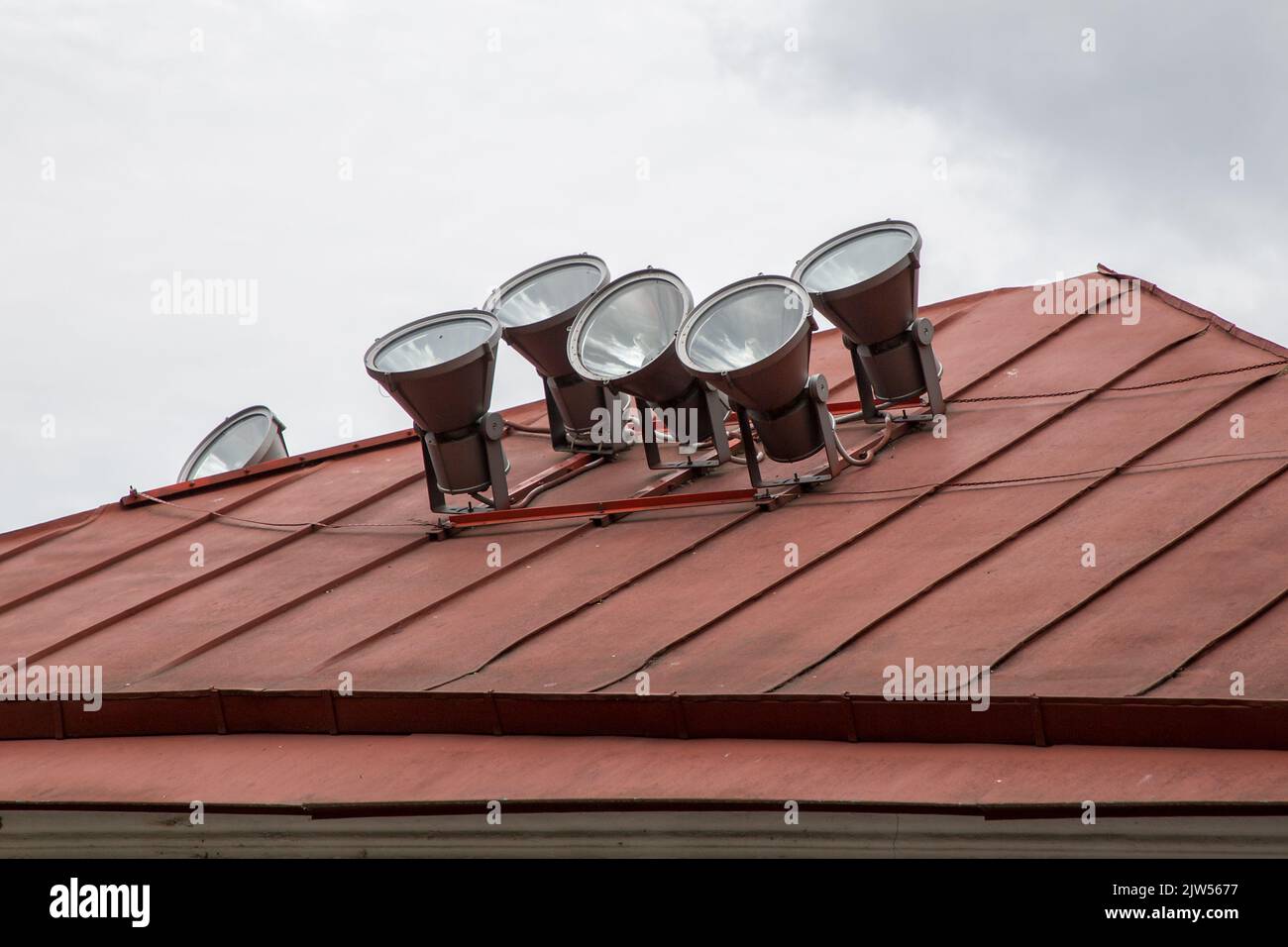 Electricity and lighting. Architectural lighting projectors on the roof ...