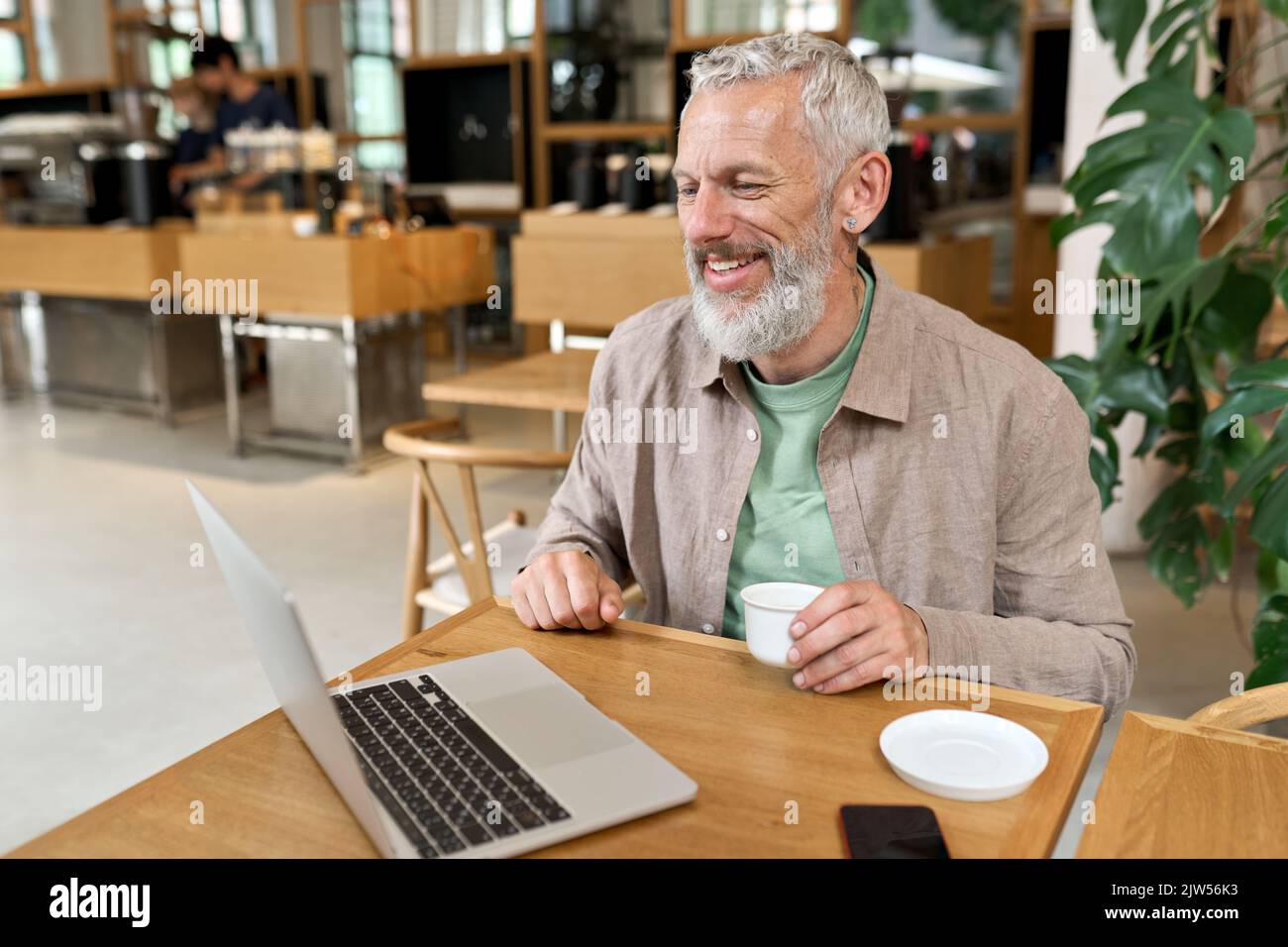 Happy older business man using laptop remote working or virtual learning Stock Photo - Alamy