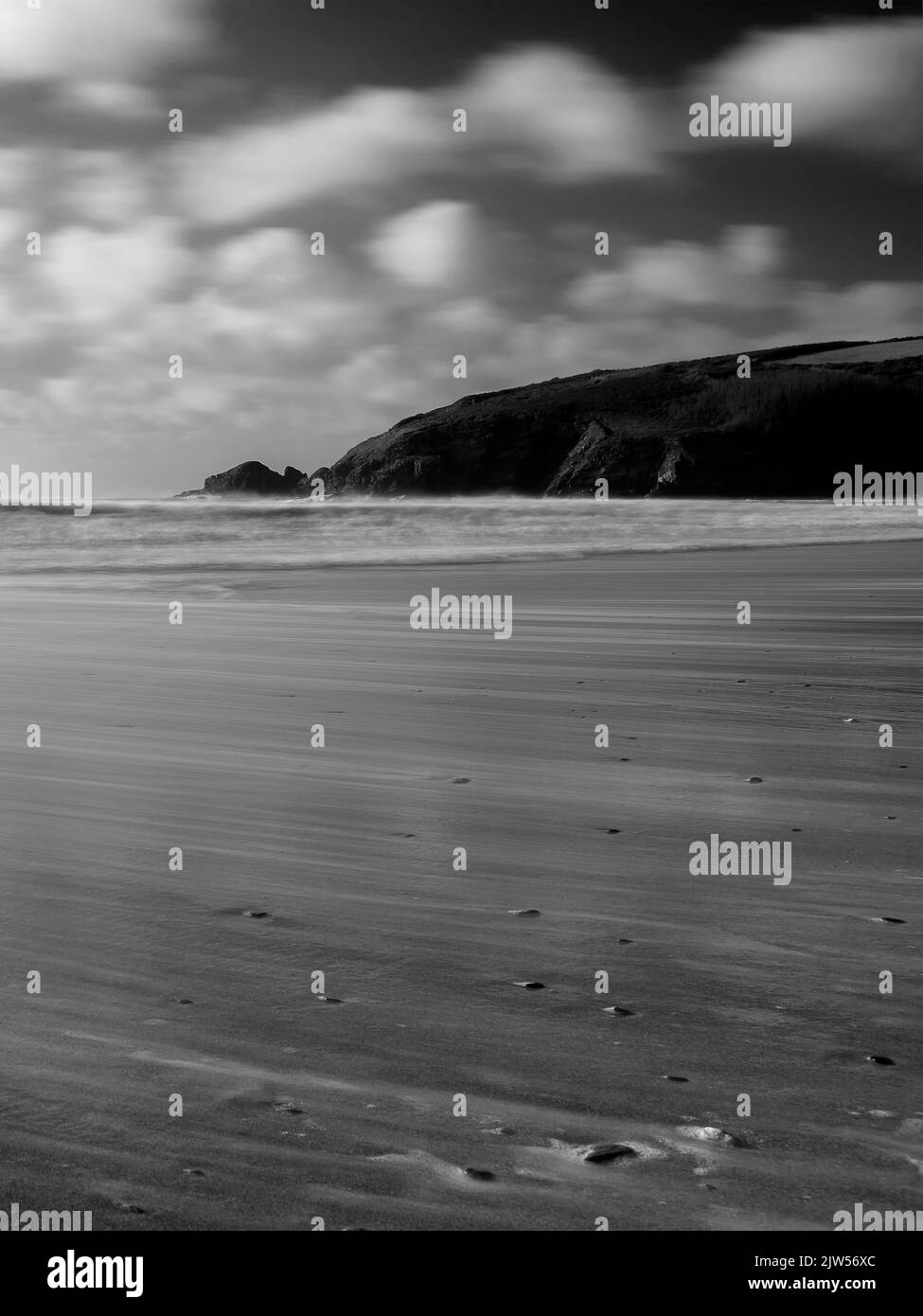 Moody waves crashing into shore at Praa sands beach Cornwall Stock ...