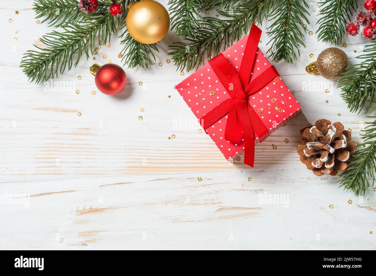 Christmas present box with red ribbon and holiday decorations Stock ...