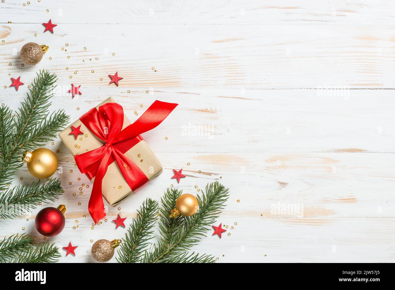 Christmas present box with red ribbon and holiday decorations Stock ...