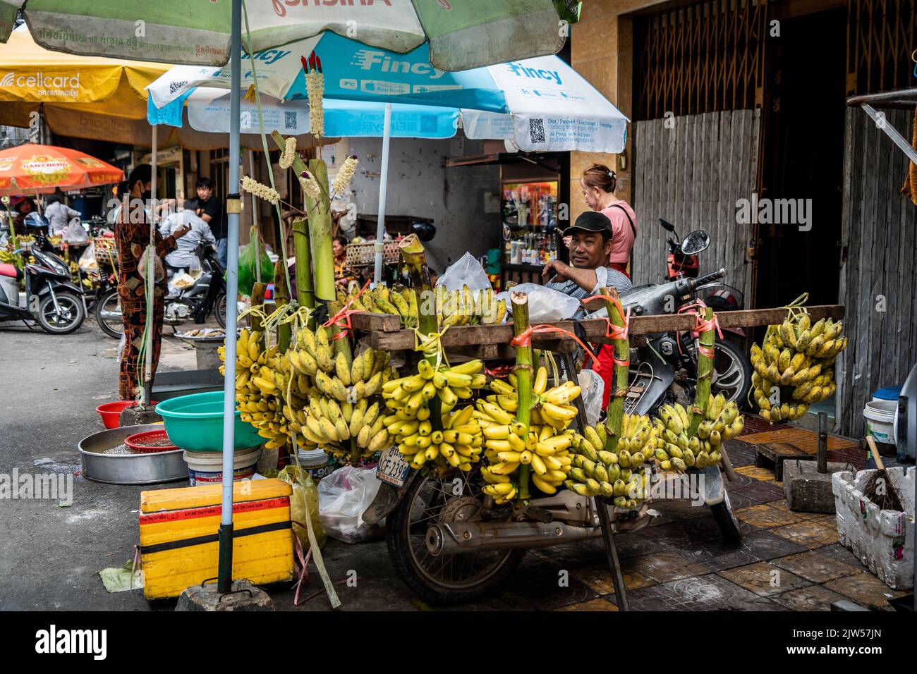 A banana vendor displays his products at an outdoor wet market in Phnom ...