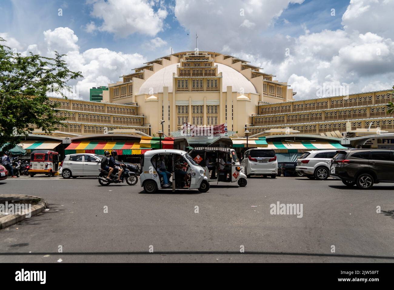 Phnom Penh, Cambodia. 3rd Sep, 2022. Electric Tuk Tuks drive past the ...