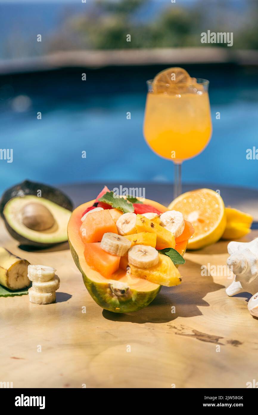 Fruits served inside a papaya. Banana, watermelon, melon, pineapple ...