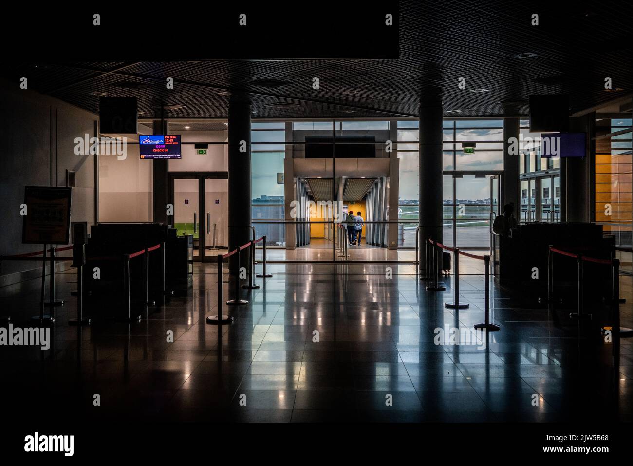 Airport gates in the international departures terminal at Phnom Penh ...