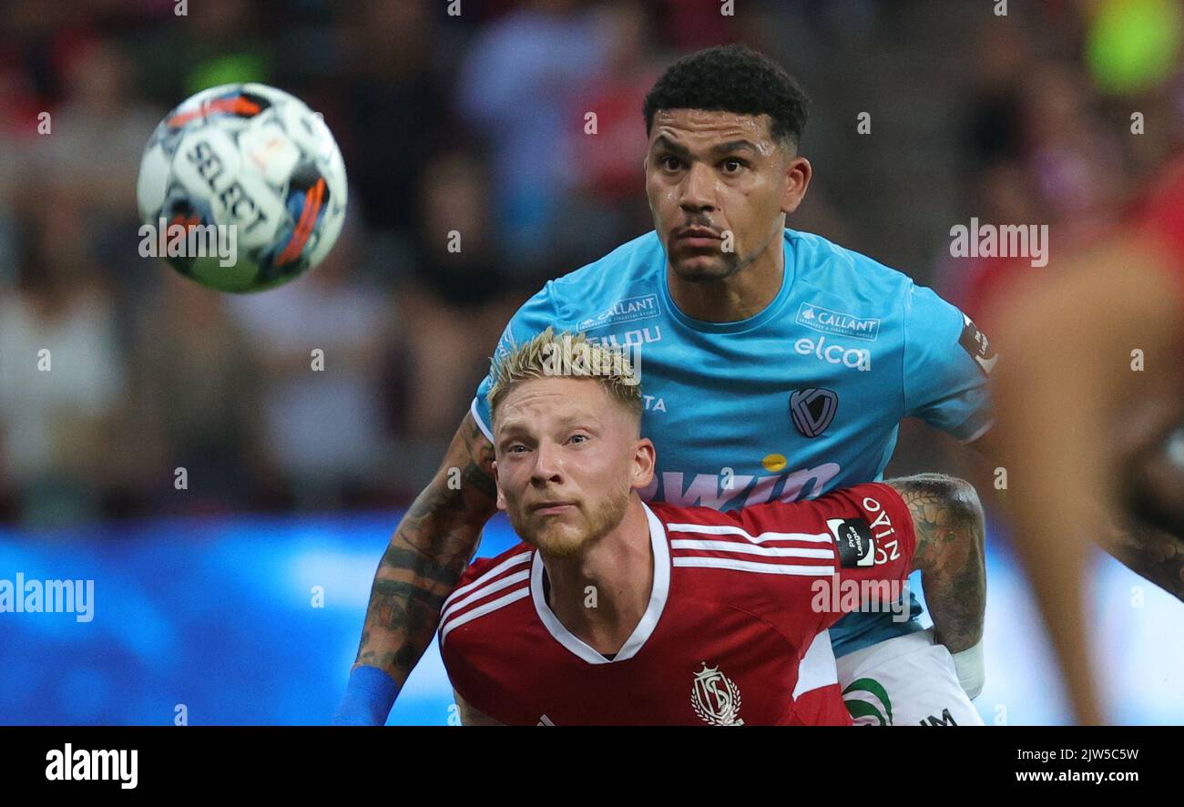 Oostende's Fanos Katelaris and Standard's Renaud Emond fight for the ...