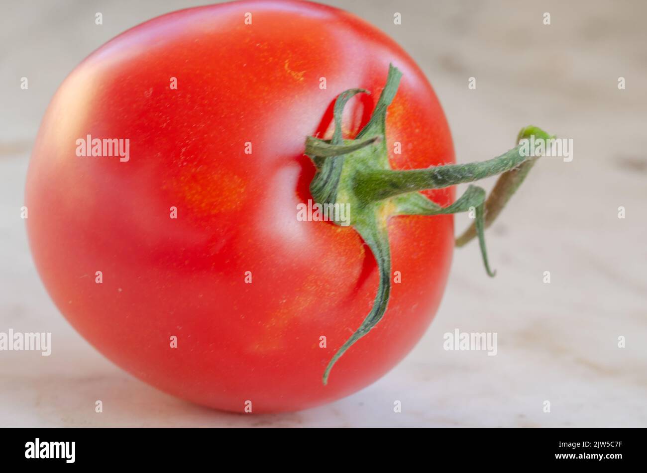 A tomato that are nice and big Stock Photo - Alamy