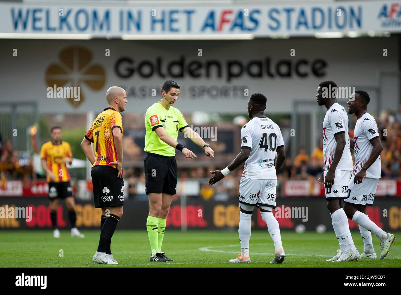 Referee Brent Staessens talks to RFC Seraing players during a soccer ...