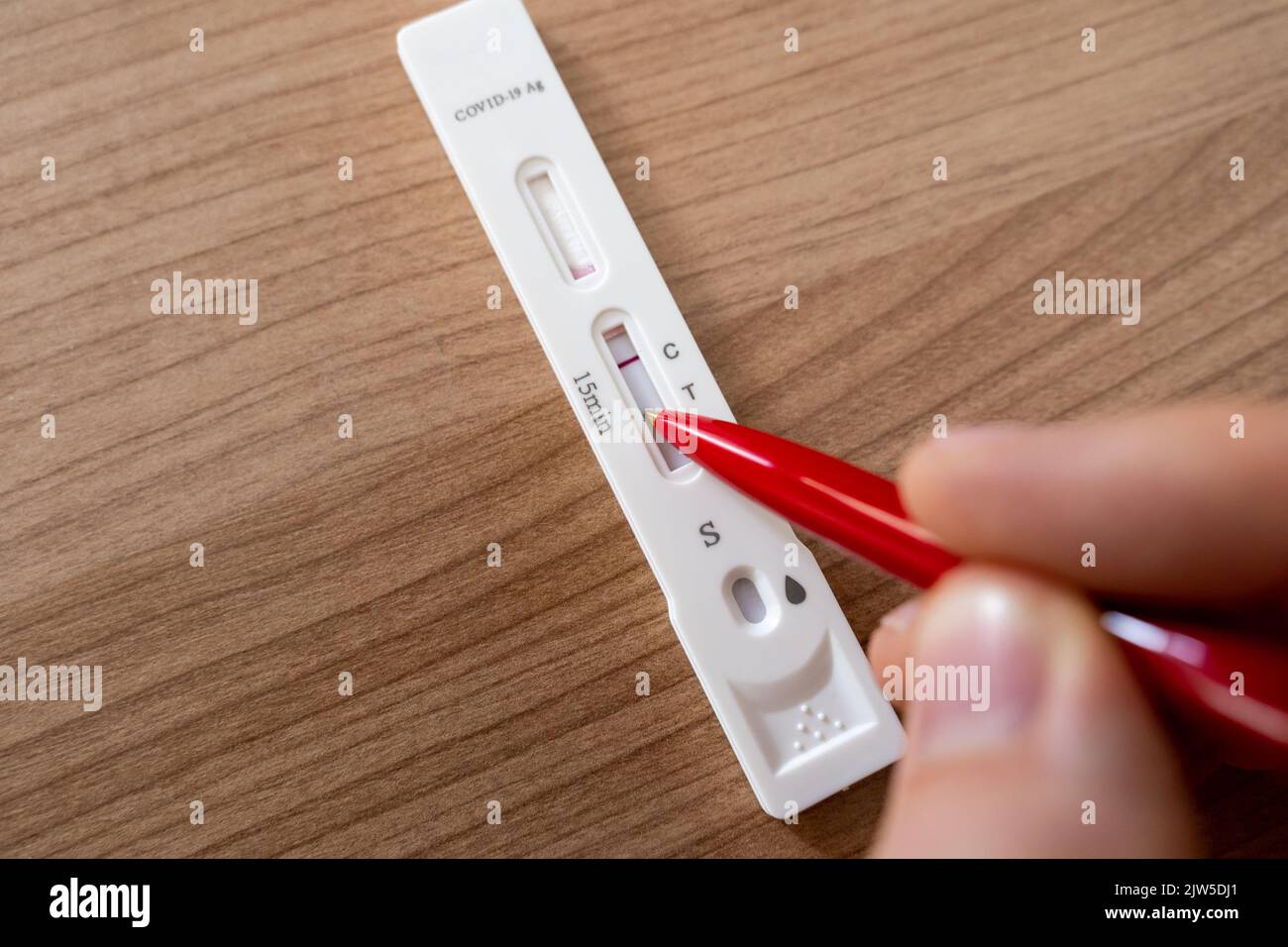 Faking a negative Covid antigen test to make it positive. Drawing a ...