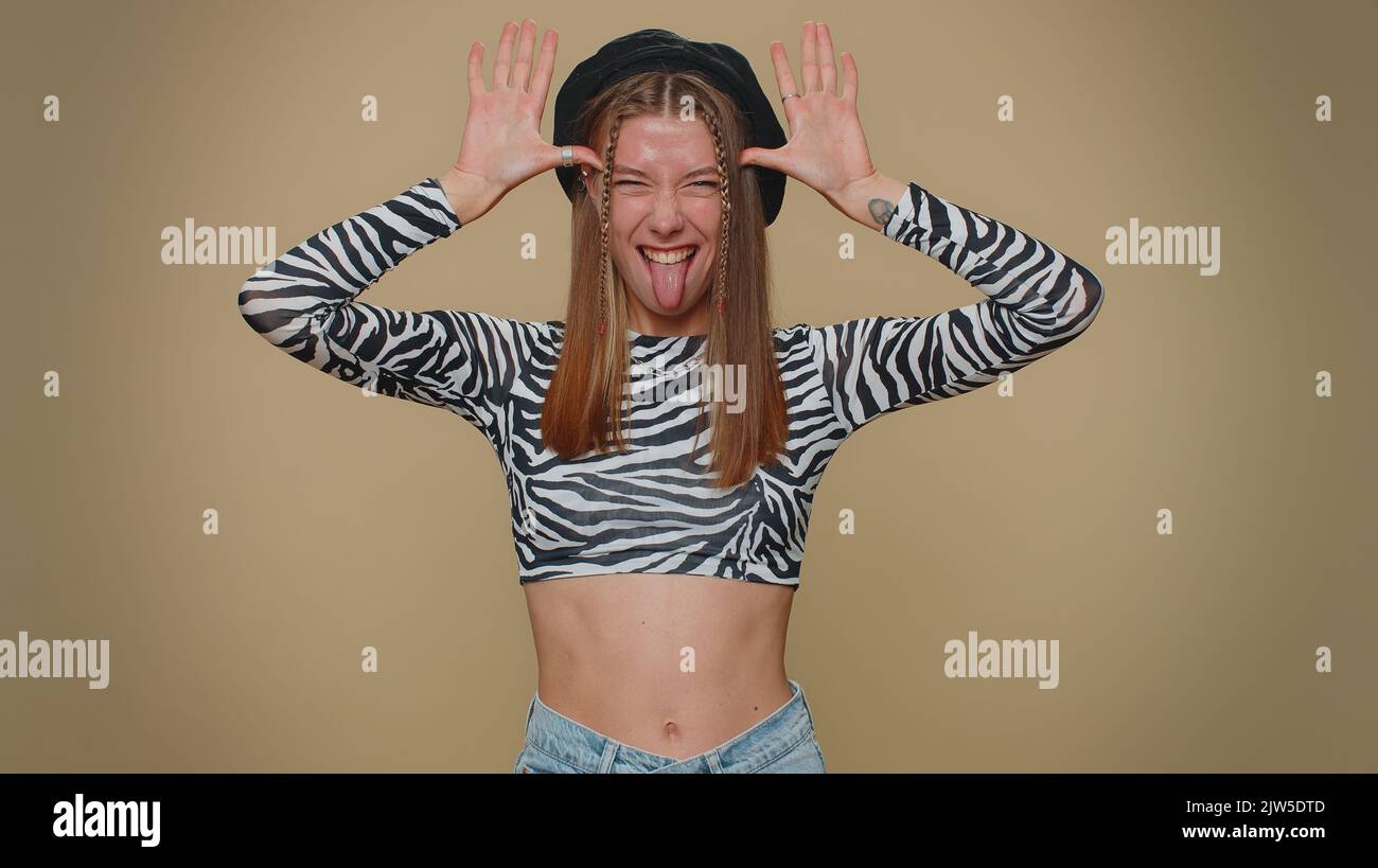 Lovely pretty funny woman in crop top making playful silly facial ...