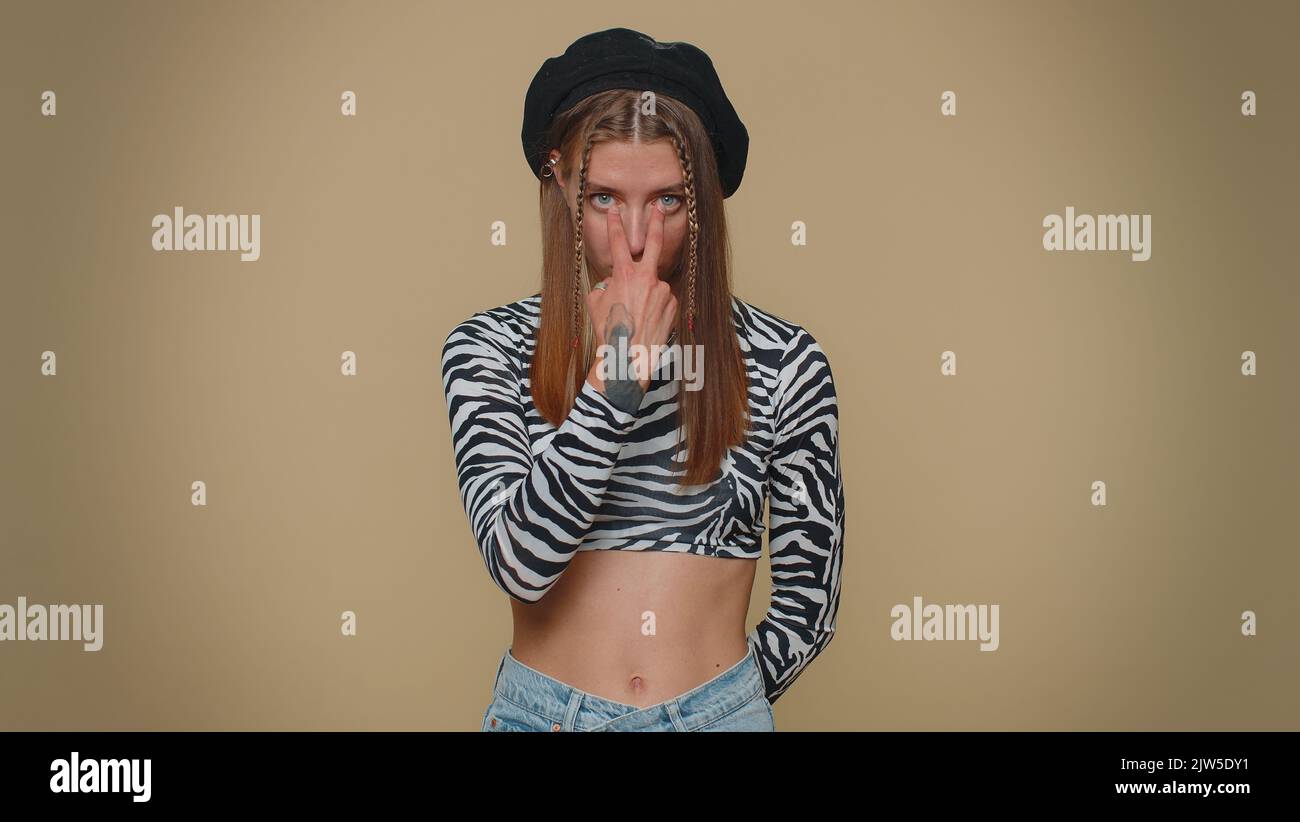 I am watching you. Lovely pretty young woman pointing at her eyes and ...