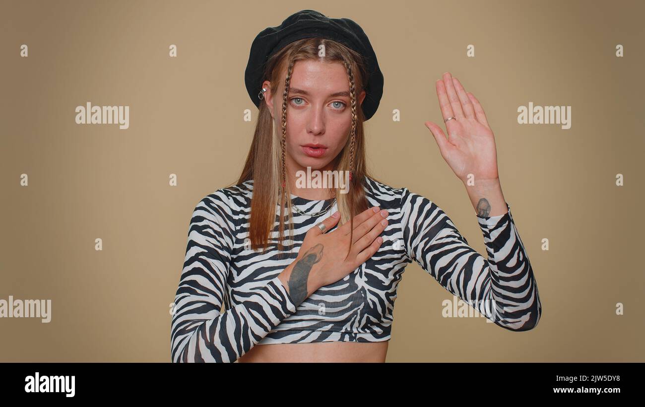 I swear to be honest. Sincere responsible pretty young woman raising ...