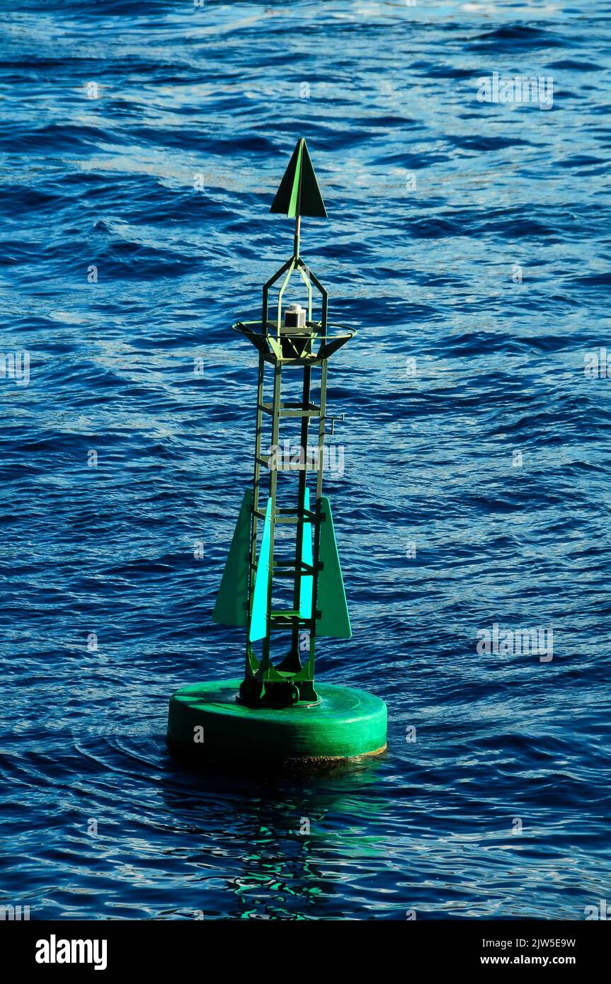 A vertical shot of a floating navigational sign in the Canary Island ...