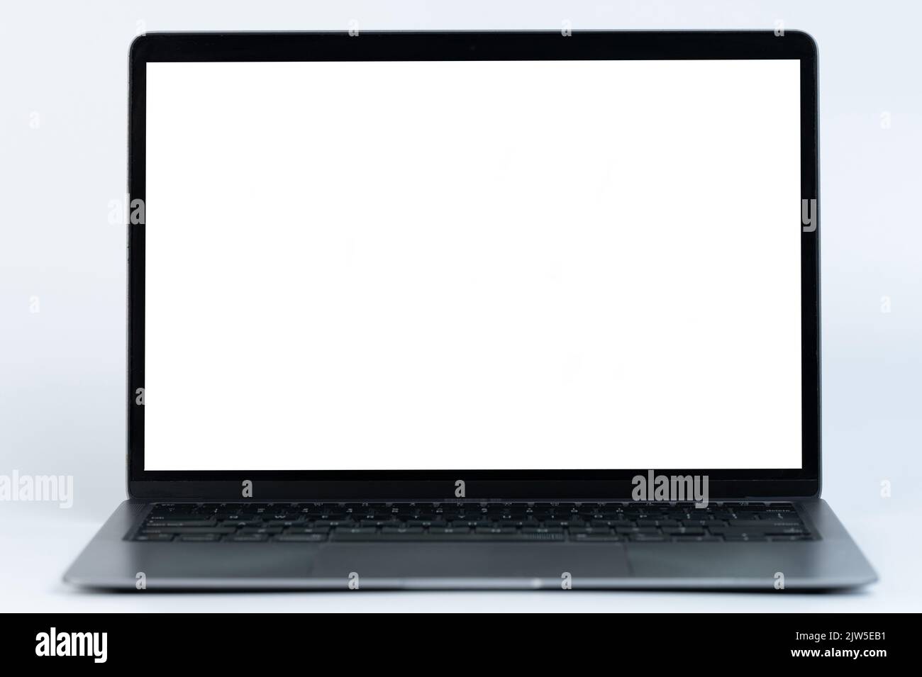 Slim gray laptop front view with clean screen isolated on studio ...