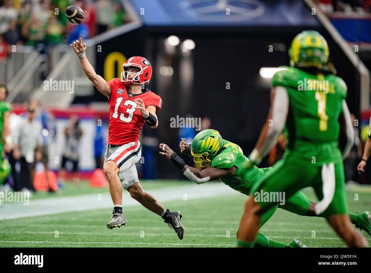 Georgia Bulldogs quarterback Stetson Bennett (13) throws the ball away ...