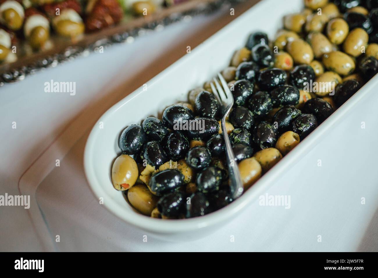 Delicious olives at a buffet table Stock Photo - Alamy