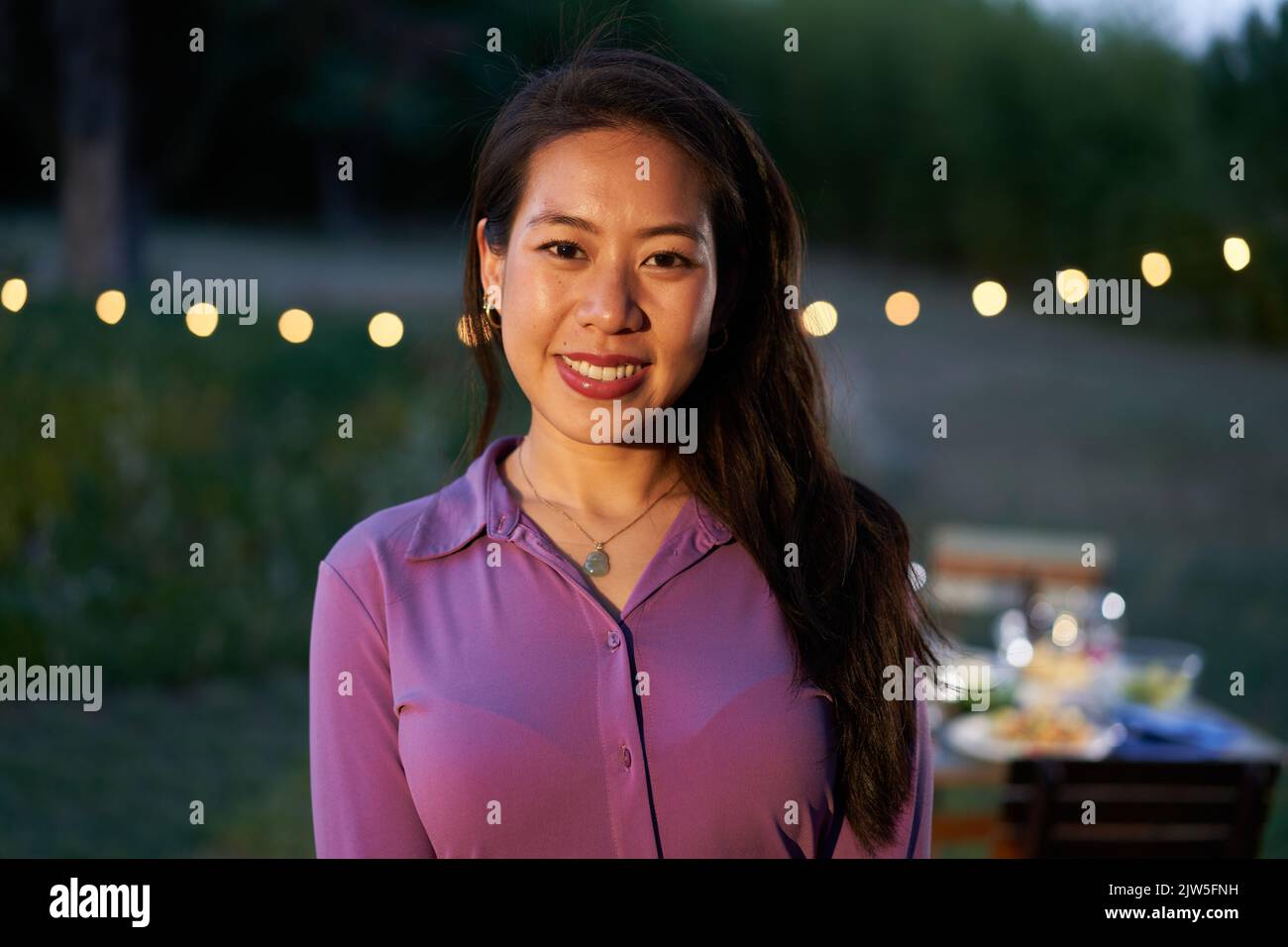 Portrait of an asian woman looking at the camera. Chinese female at ...