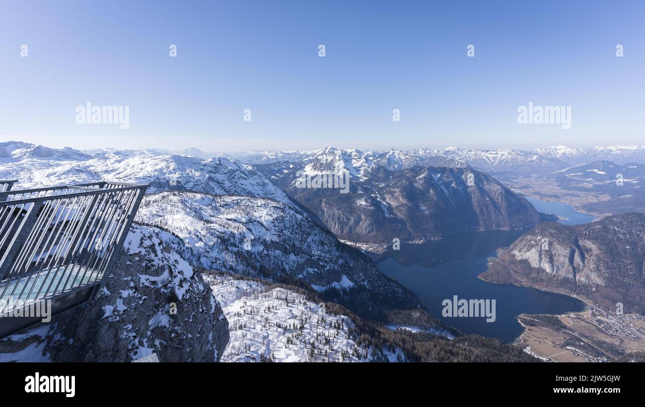 Viewing platform above winter alpine landscape with valley, mountains ...