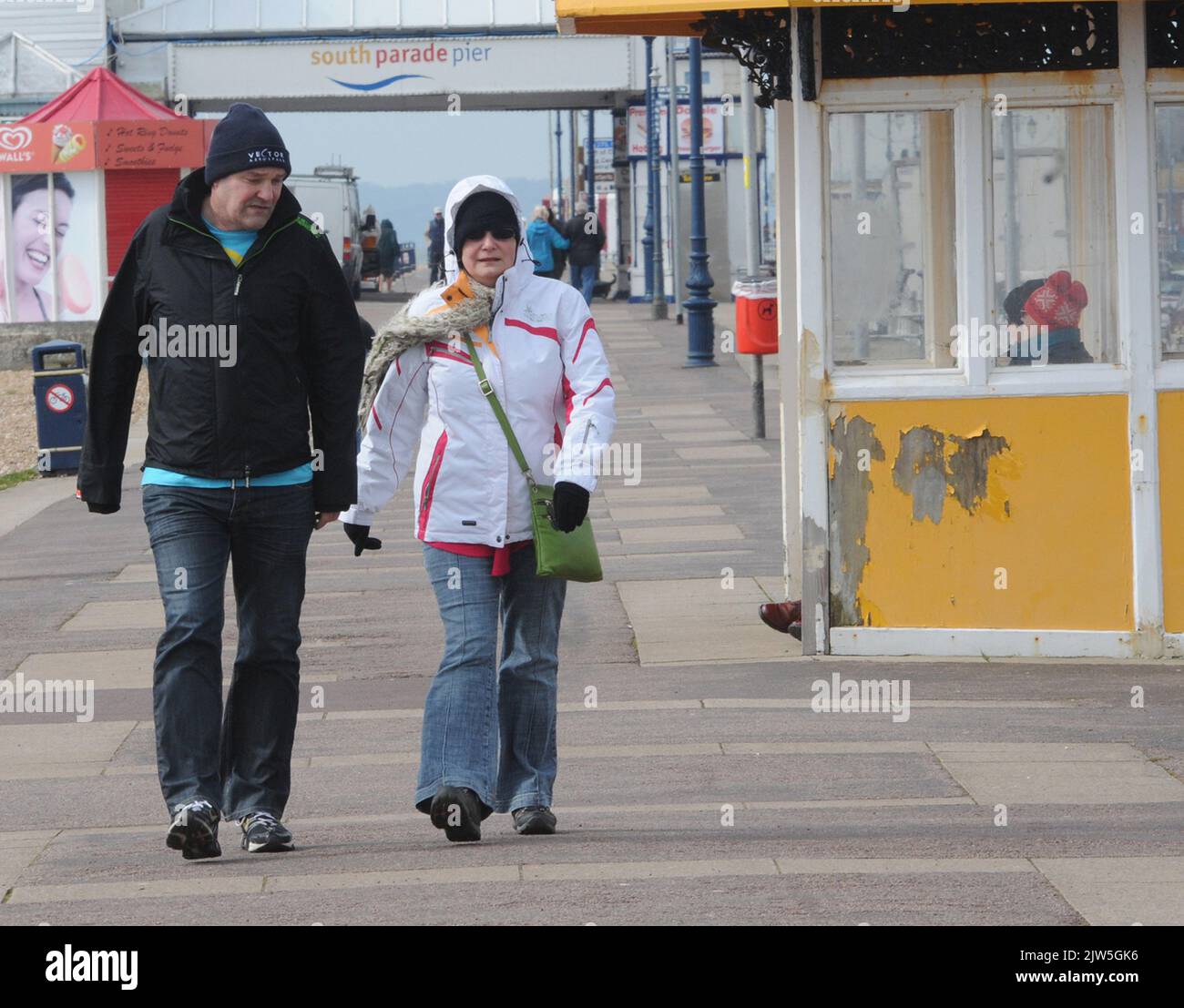 COUPLE WRAPPED UP AGAINST THE BITTER GOOD FRIDAY WIND STROLL ALONG THE ...
