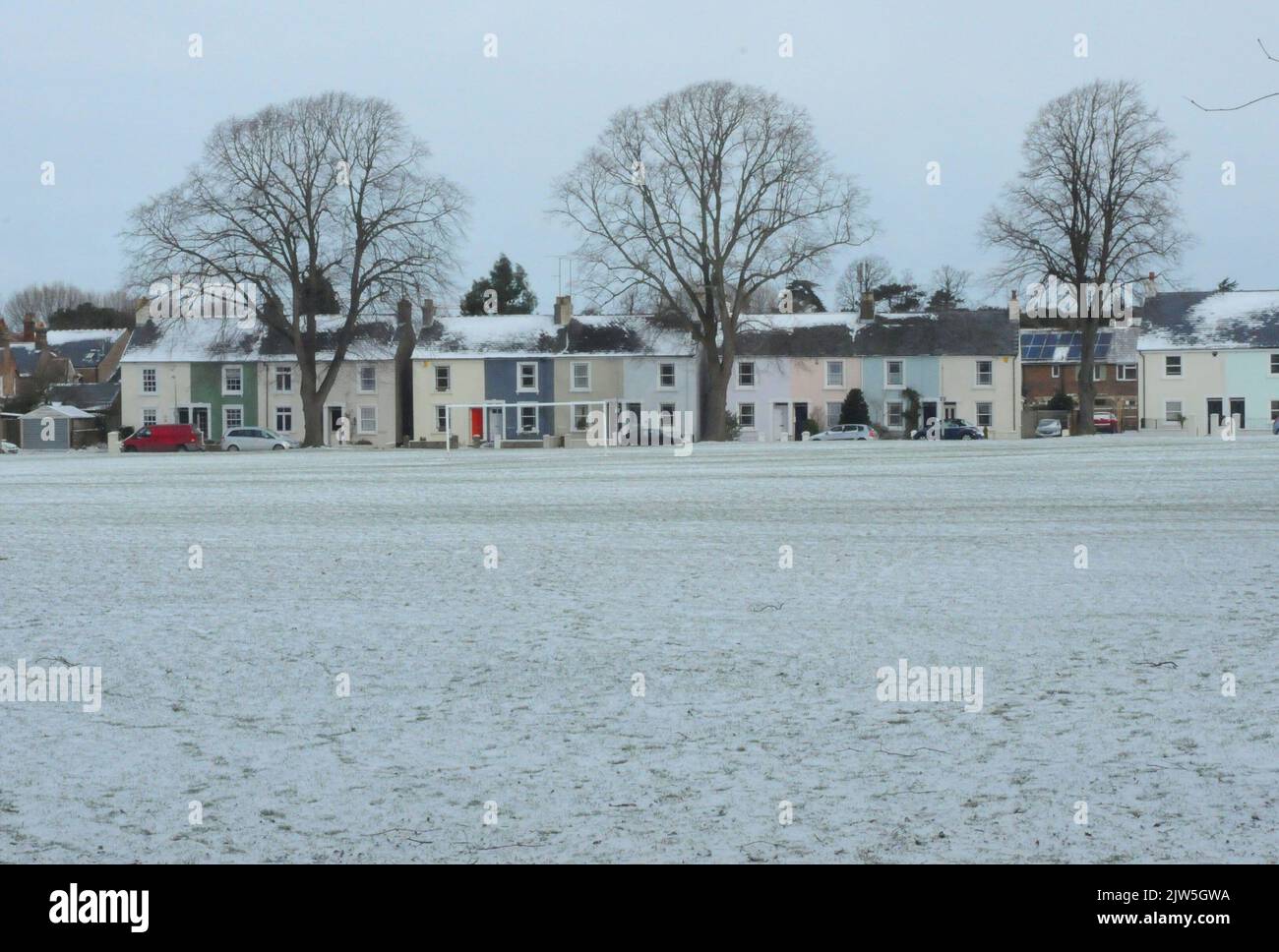 COLOURFUL TERRACE OF COTTAGES IN THE SNOW AT , CHICHESTER, WEST SUSSEX ...
