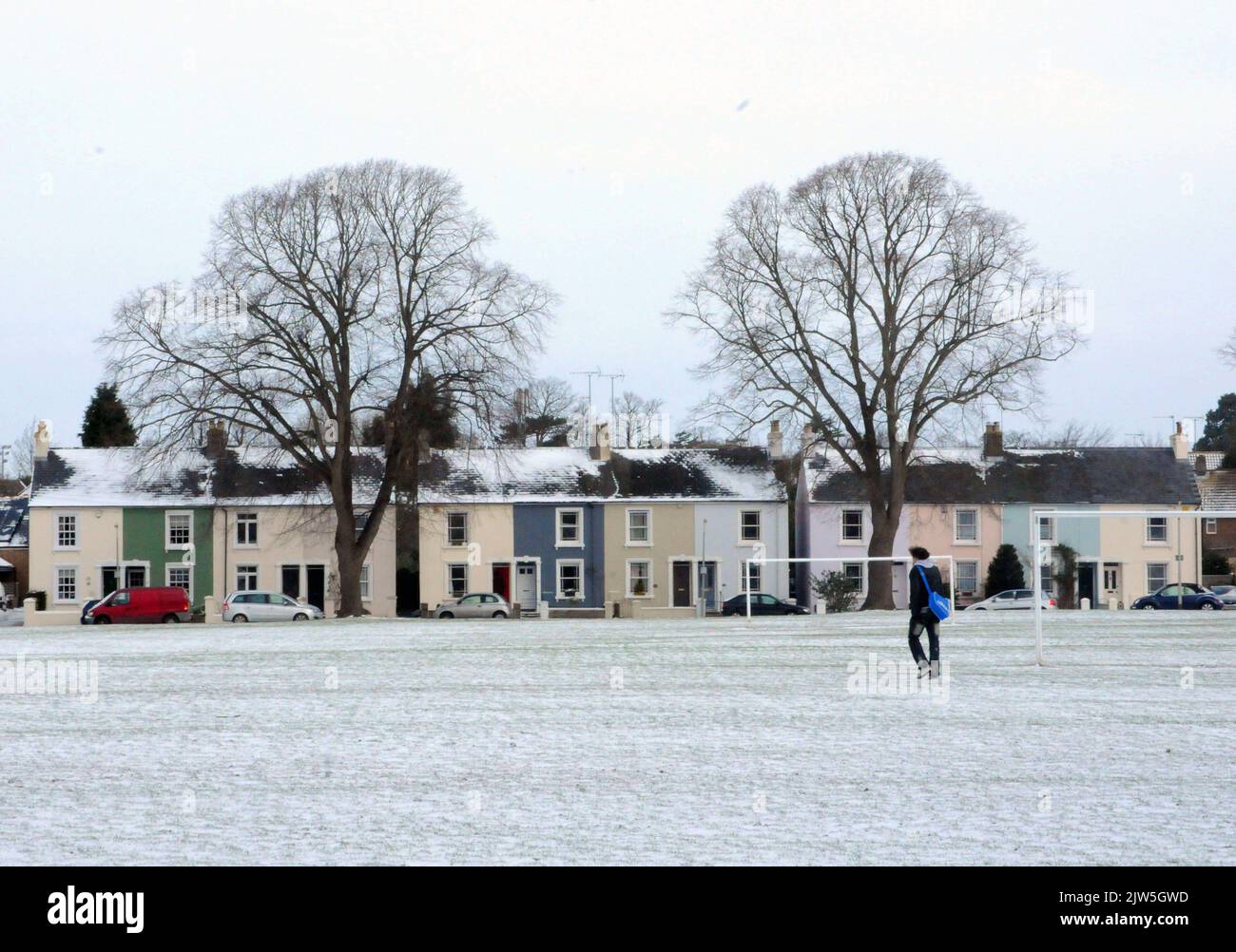 A COLOURFUL TERRACE OF COTTAGES IN THE SNOW AT CHICHESTER, WEST SUSSEX ...
