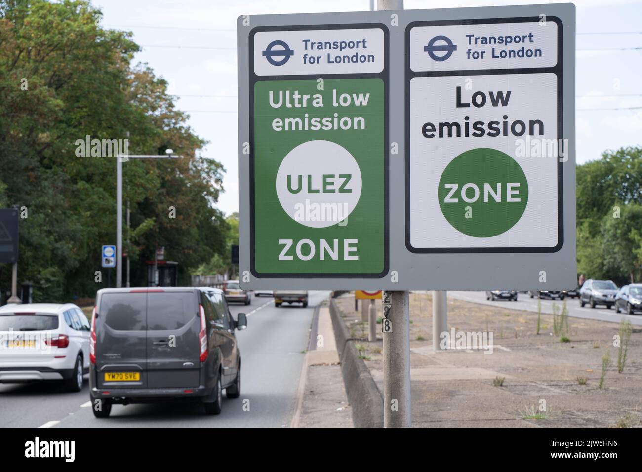 vehicles driving pass TFL signages for ULEZ - Ultra Low Emission Zone ...