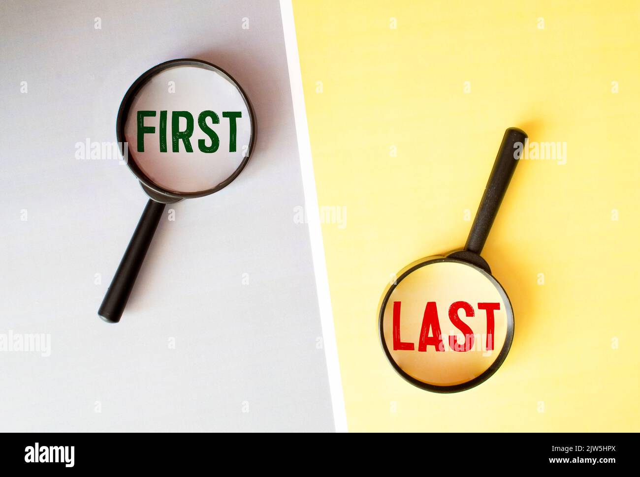 Orange and Yellow paper with last and first words on a blackboard Stock ...