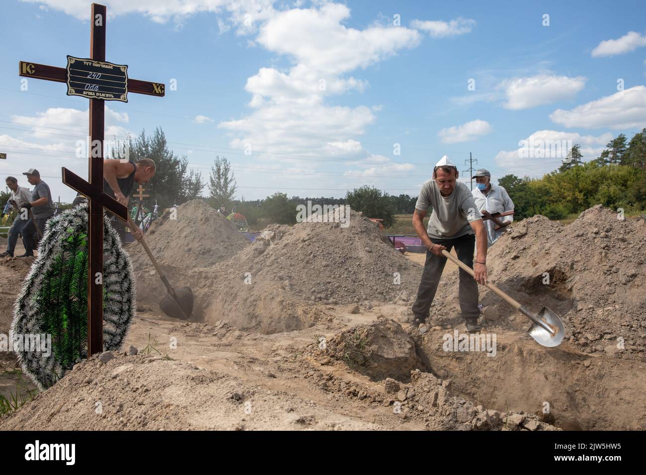 Bucha, Ukraine. 02nd Sep, 2022. A local worker is seen digging a grave ...