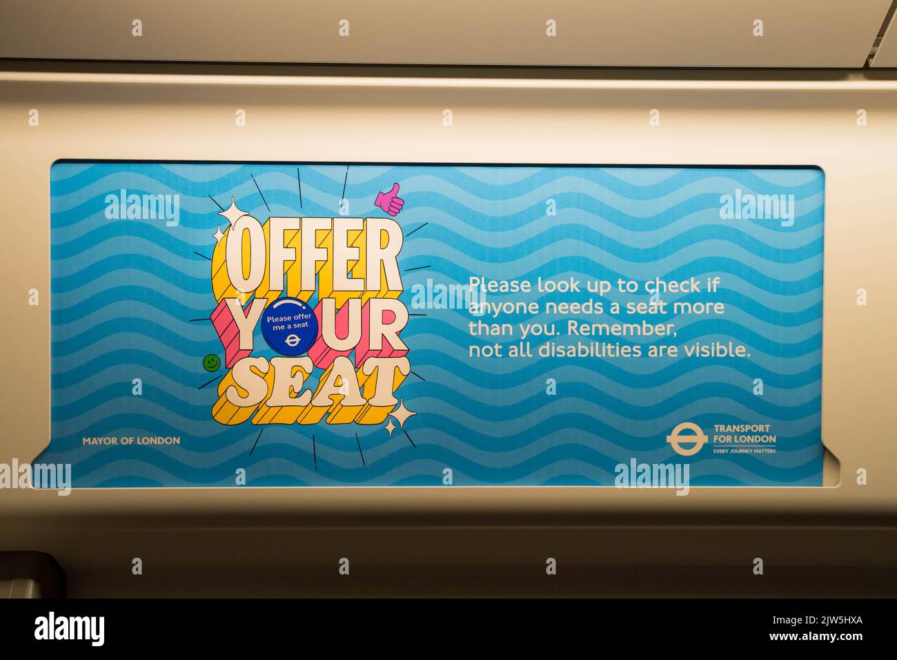 poster advising tube passengers to "offer your seat" in white on blue ...