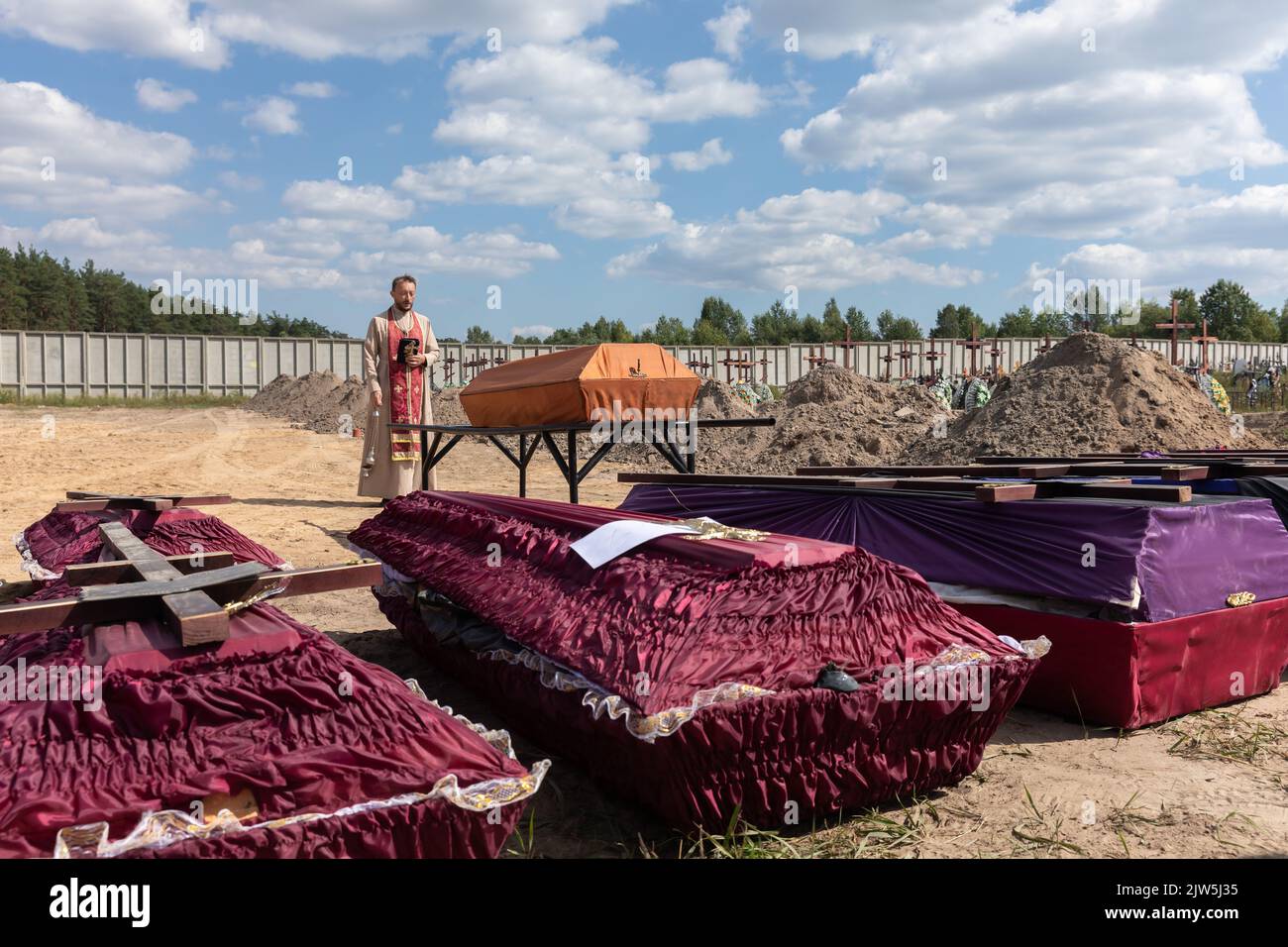 Bucha, Ukraine. 2nd Sep, 2022. A priest reads a prayer and performs a ...