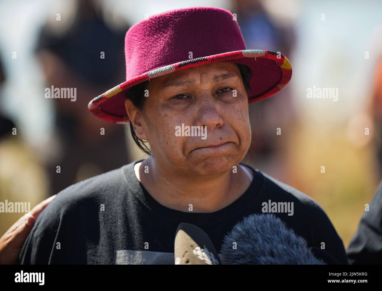Sheila Poorman pauses while speaking during a vigil for her daughter ...