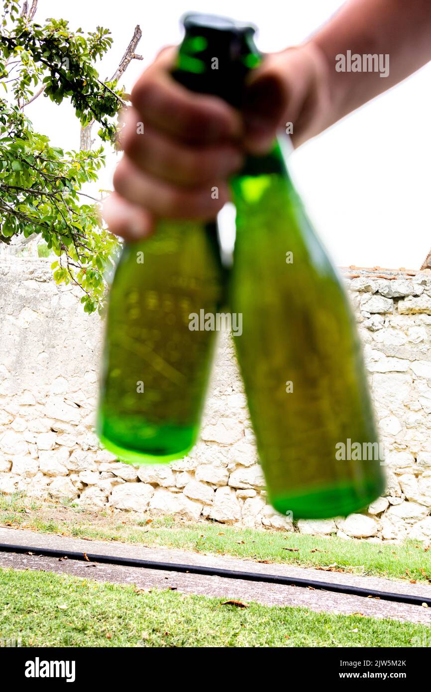 Man hand picking beer bottle hi-res stock photography and images - Alamy