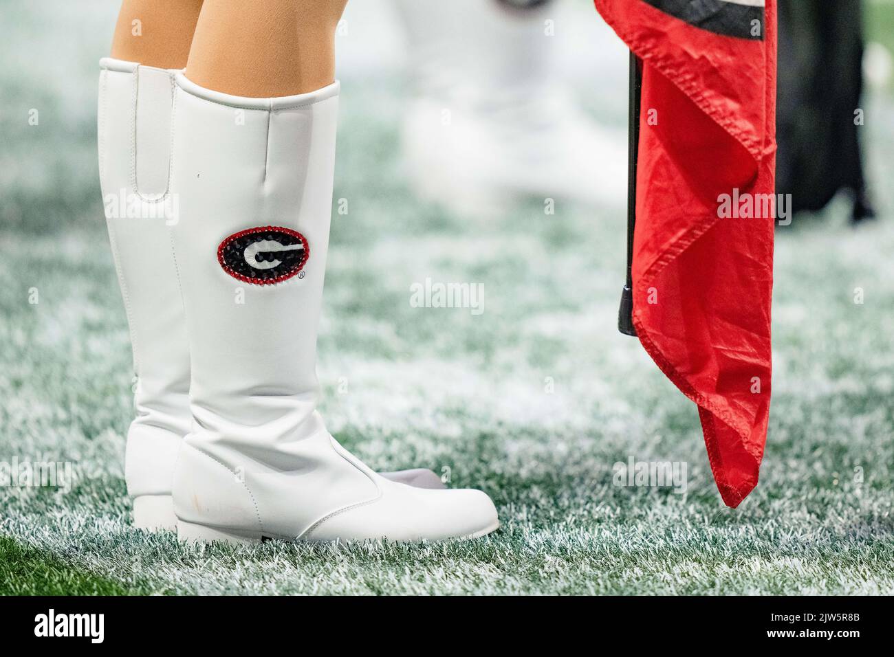 The boots of the Georgia Bulldogs marching band baton twirlers during ...