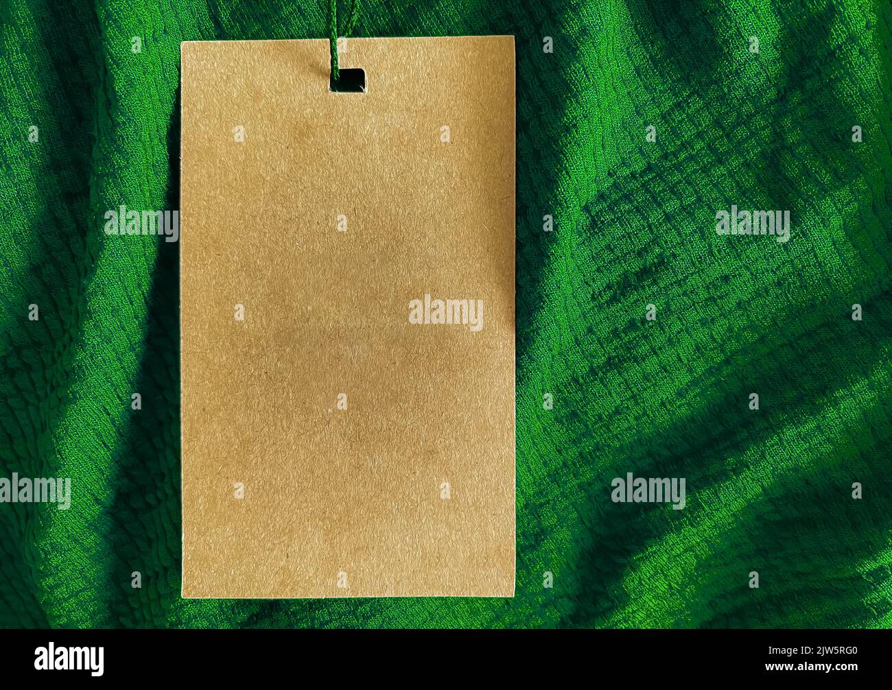 Blank fashion label tag, sale price card on luxury fabric background ...