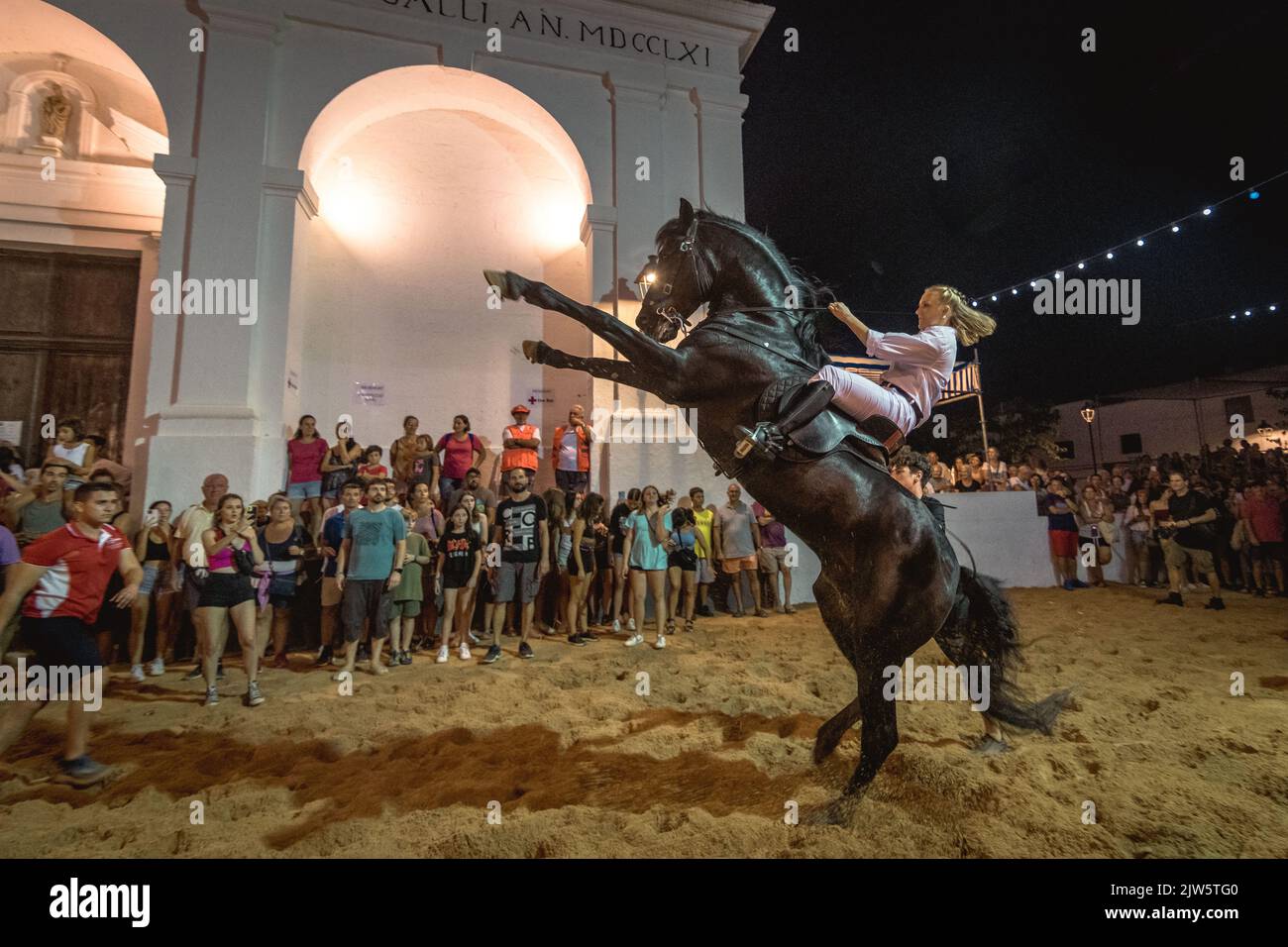 Sant Lluis, Spain. 3rd Sep, 2022. A 'caixer' (horse rider) rears up on ...