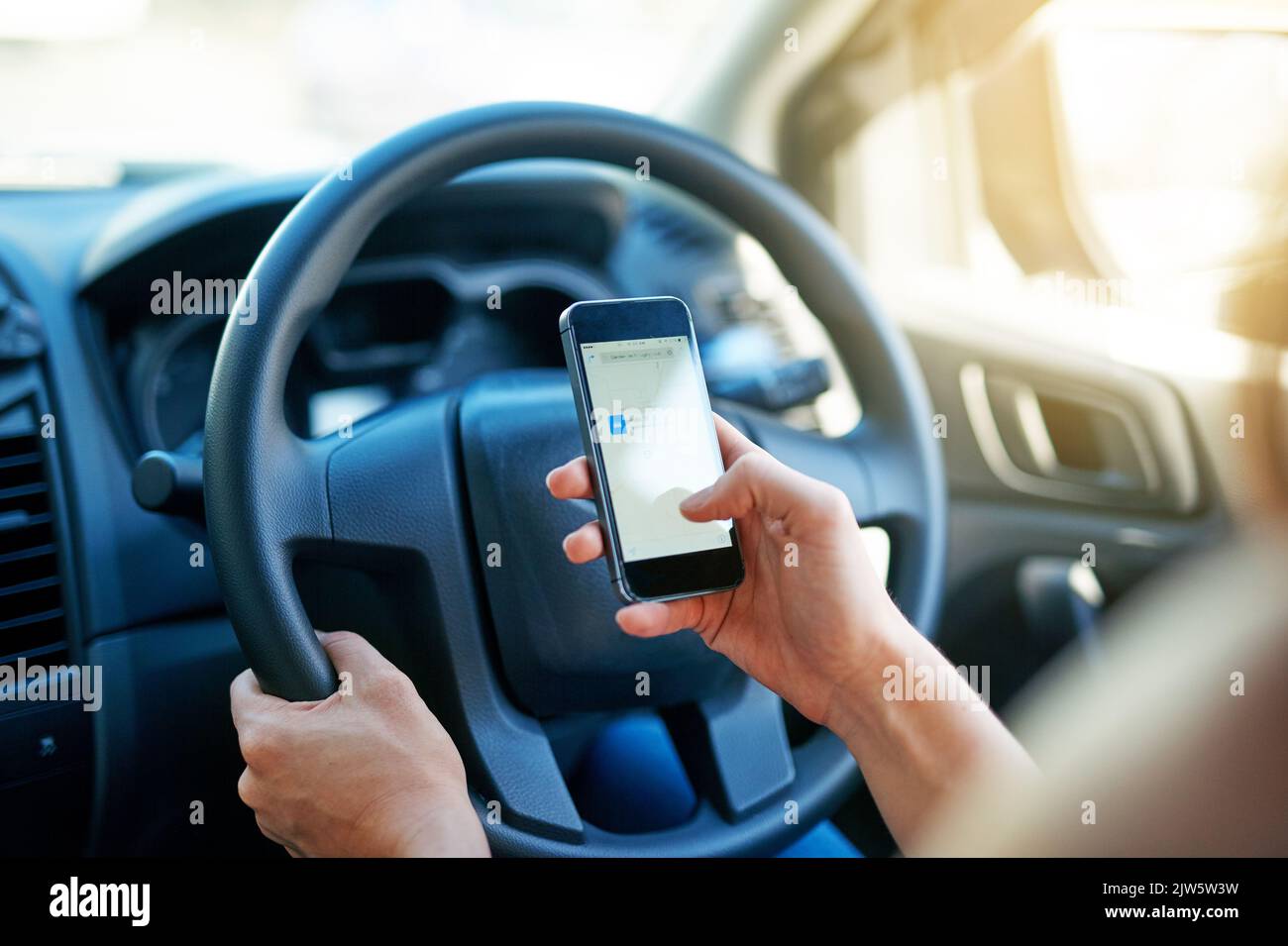 Searching for the right destination. Closeup shot of a woman using a ...